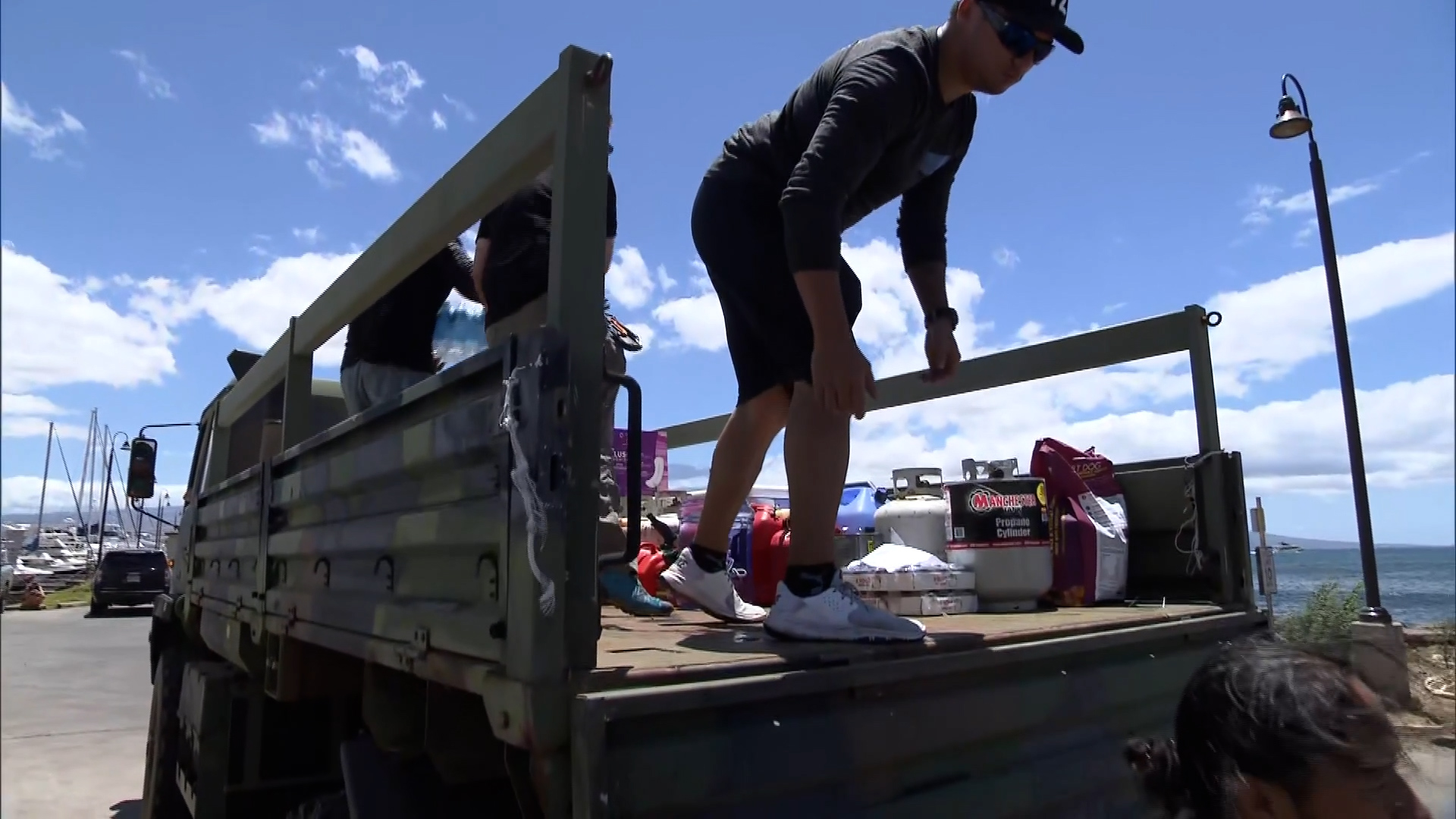 Volunteers in Hawaii chant as they load supplies for those impacted by ...