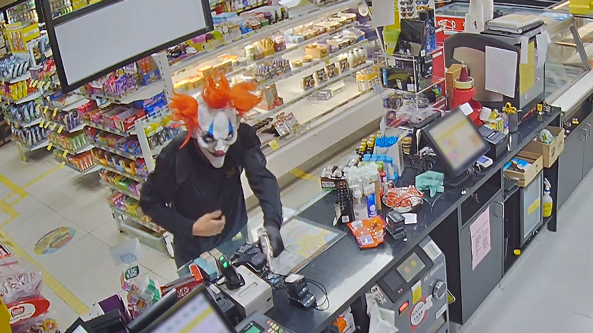 WATCH: Armed robber wearing creepy clown mask holds up store in Australia