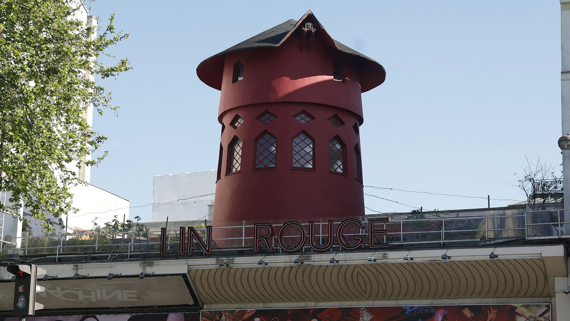 Sails fall off the landmark Moulin Rouge's red windmill in Paris