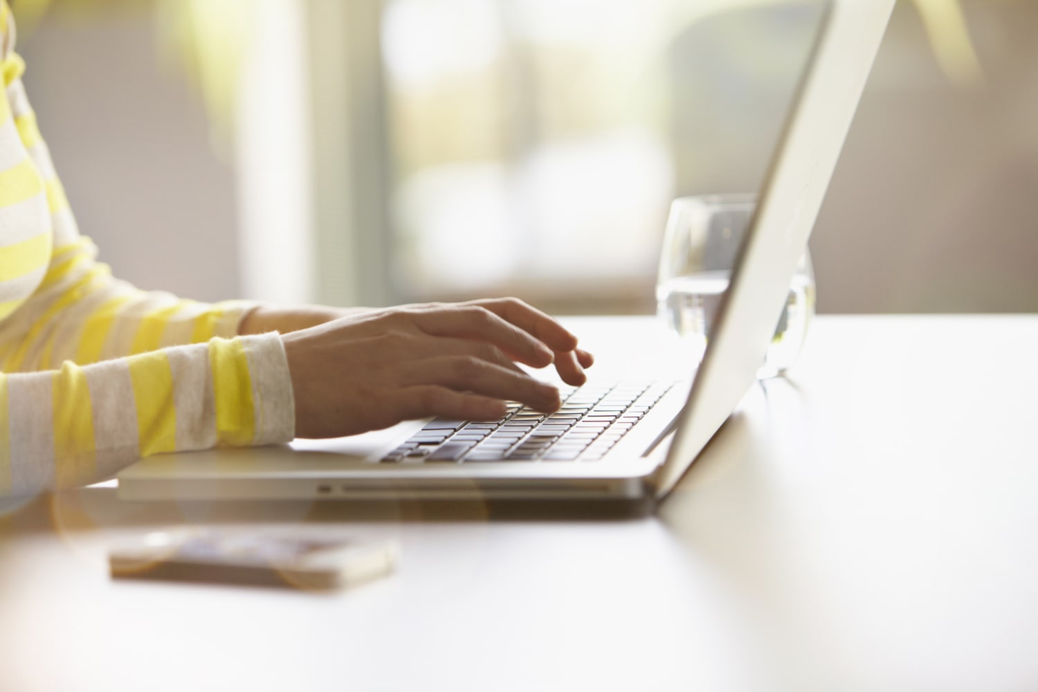 Person Typing A Letter
