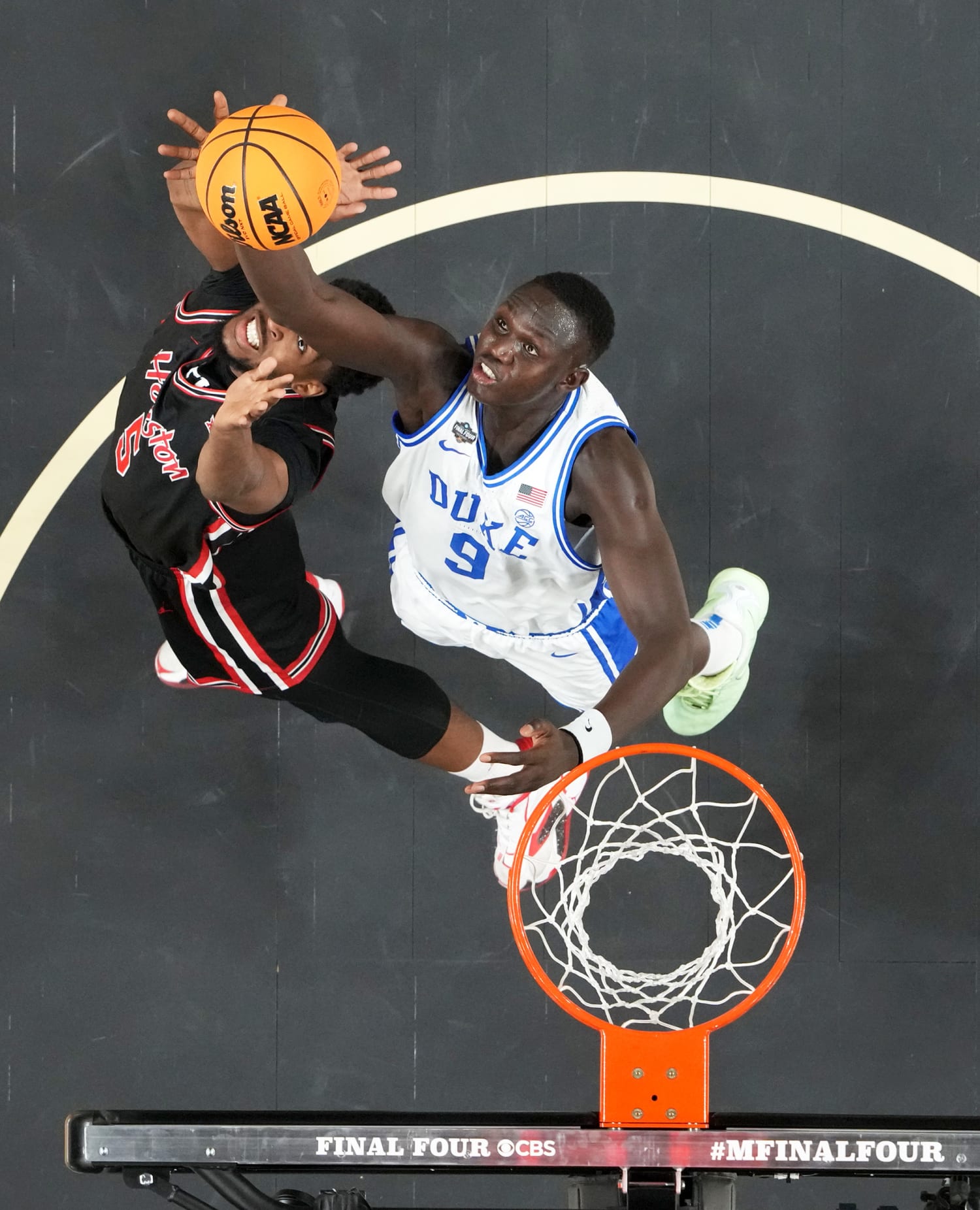 Basketball Players Slam Dunk