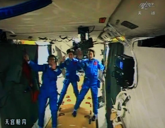 Chinese astronauts enter orbiting space module