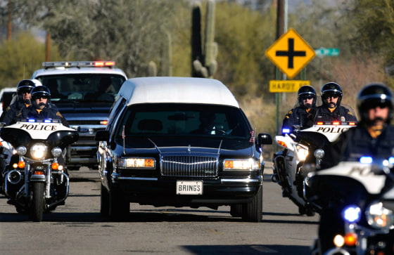 Slain federal judge mourned as fair jurist, family man