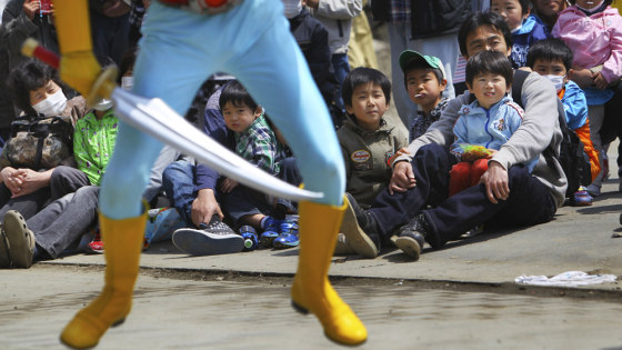 Superheroes cheer children in Japan's tsunami zone