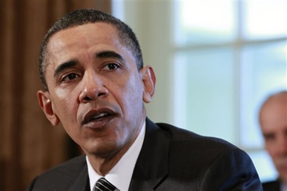 Obama job approval slips to new low
