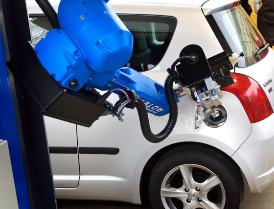Inventors unveil robot to fill car gas tank