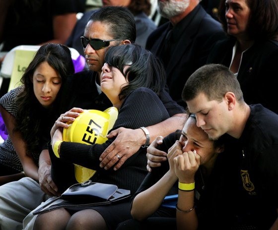 Thousands honor dead firefighters