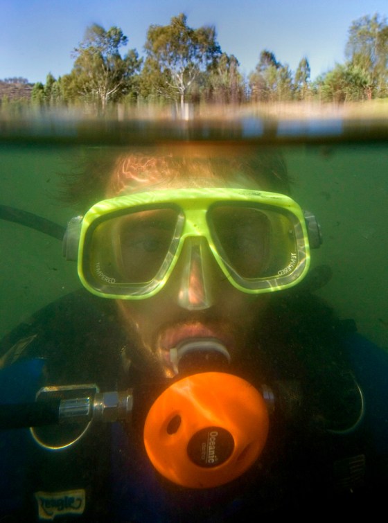 Scientist emerges from underwater box