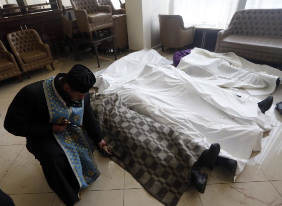 Priest Performs Last Rites on Killed Protesters