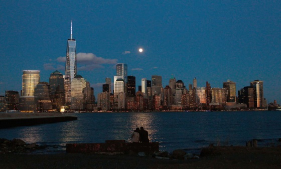 Moon Rises Above New York City Skyline