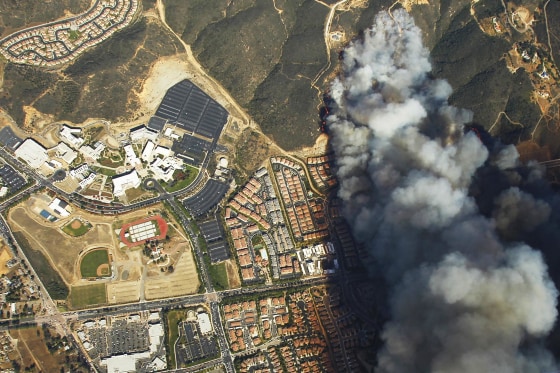 Aerial View: Cocos Fire Threatens Homes, College
