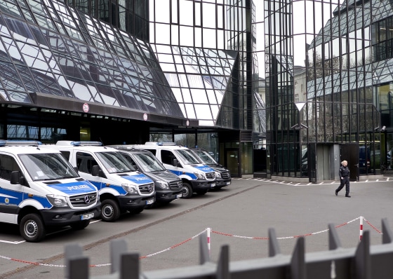 Deutsche Bank shares slide after police raid offices in money ...