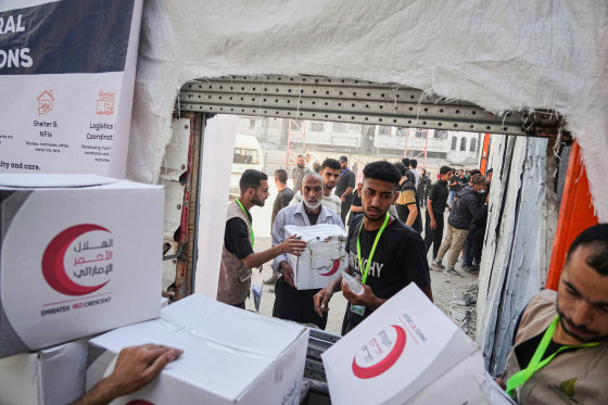 Israel halts aid, official says, as Palestinian clans in Gaza deny ...