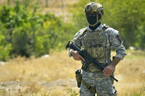 Kurdish PKK militants begin handing over weapons in cave in Iraq