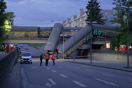 One dead after freight trains collide and crash off bridge in Munich