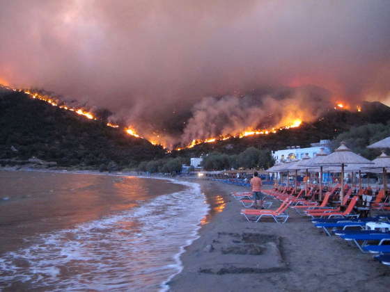 Burning at the beach: Greeks watch wildfire approach
