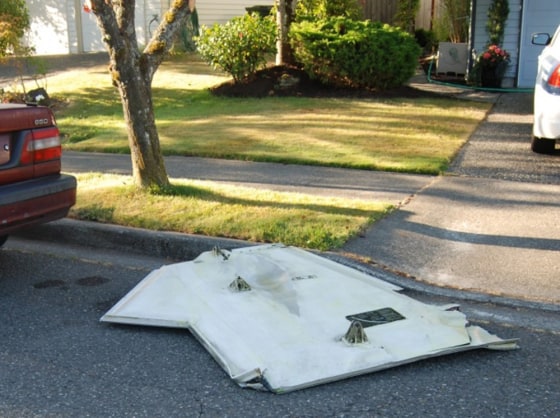 Boeing 767's landing gear door falls into neighborhood near Seattle