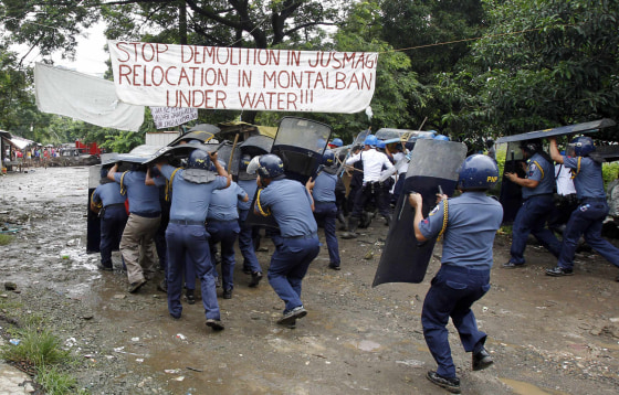 Squatters clash with police over demolition of their homes in the ...