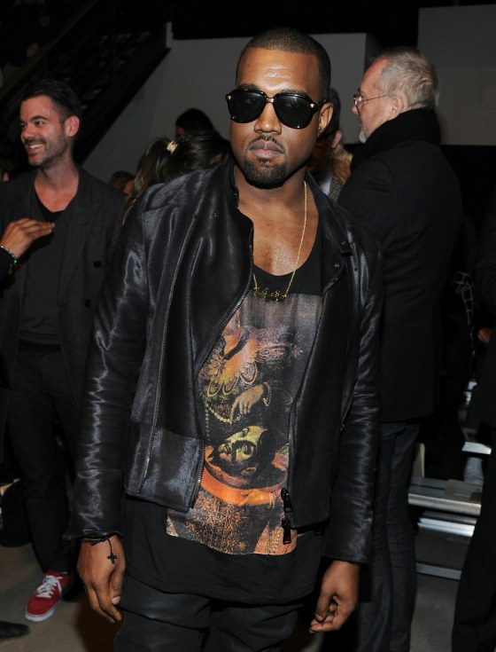 Kanye's handler's keeping him in line at Fashion Week