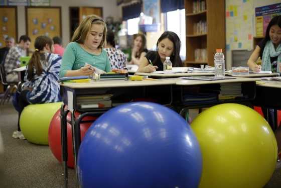 Teachers ditch student desk chairs for yoga balls