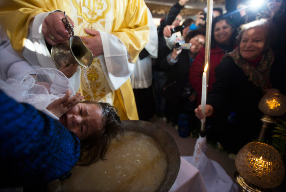 Christians gather on banks of Jordan River for baptism