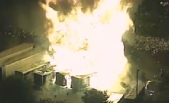 Thousands of destroyed propane tanks litter parking lot after plant ...