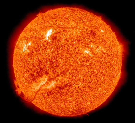 A 'snake' slithers across the sun
