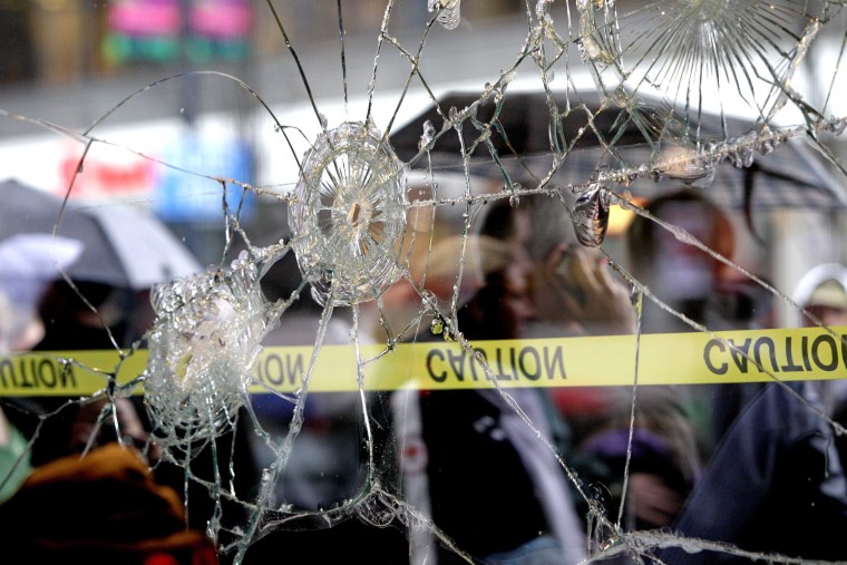 Olympic protesters smash store windows