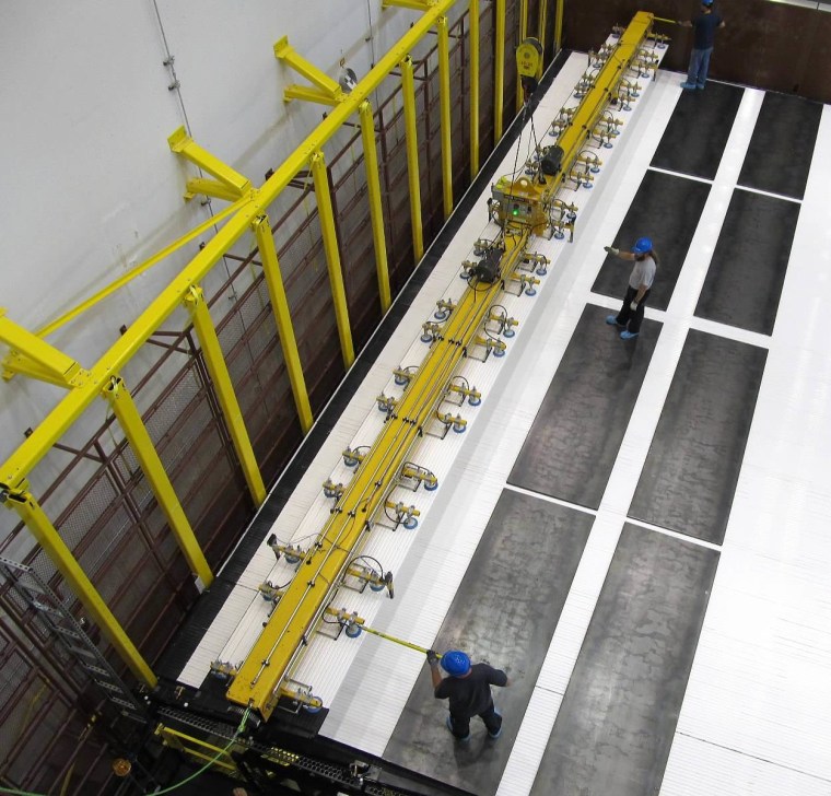 Sprawling experiment gears up to catch tiny neutrinos