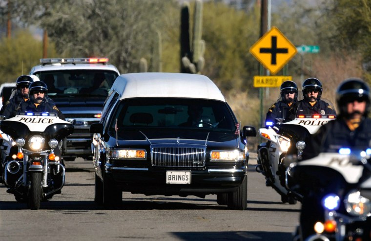 Slain federal judge mourned as fair jurist, family man