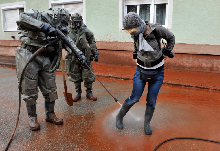 Toxic red sludge floods towns near Budapest