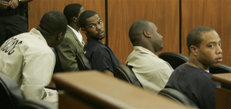 Men get long prison terms for armored car heist