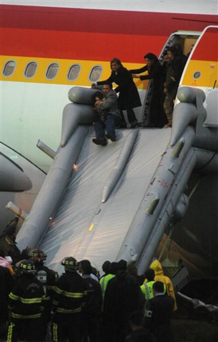 Plane skids off runway after tire explodes