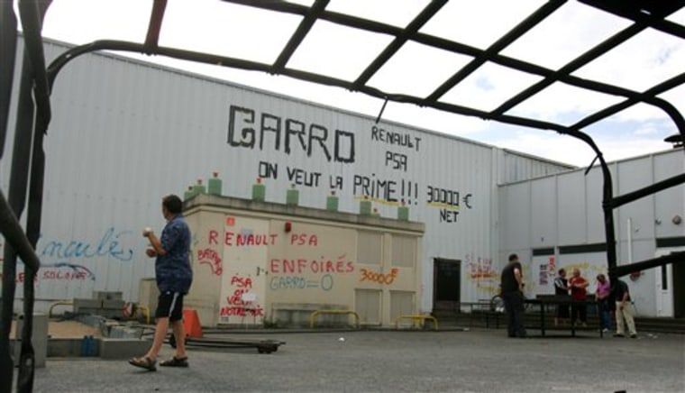 French auto workers threaten to blow up factory