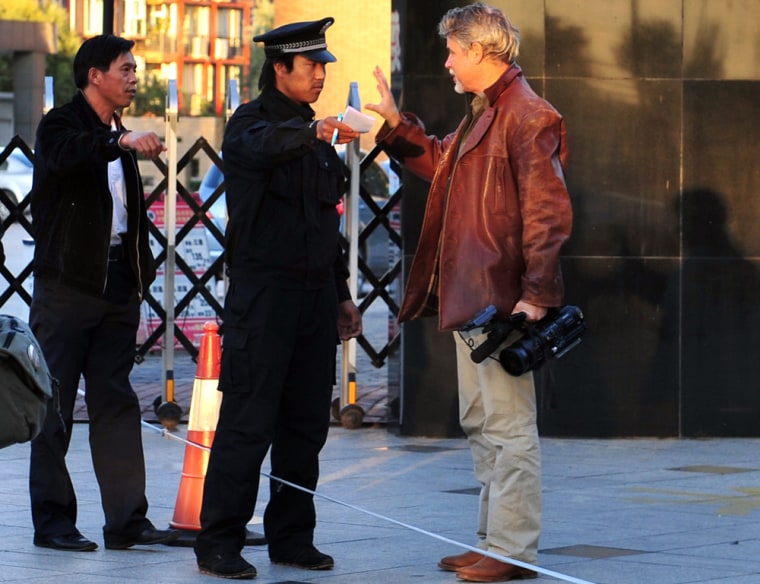 China eases restrictions on foreign journalists