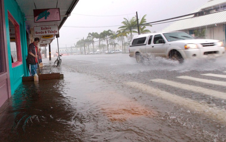 Record rains slam Hawaii, force evacuations
