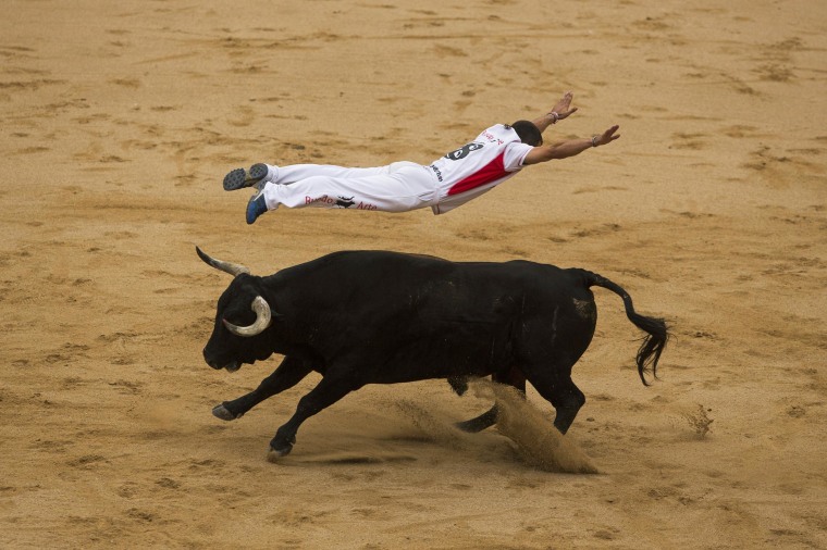 Leaper Flies Over Bull in Spain