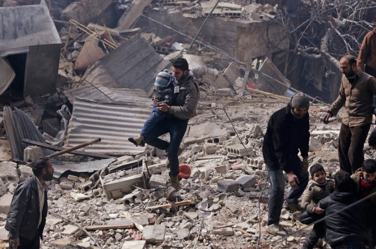 Syrians Rescue Children From Rubble of Destroyed Building