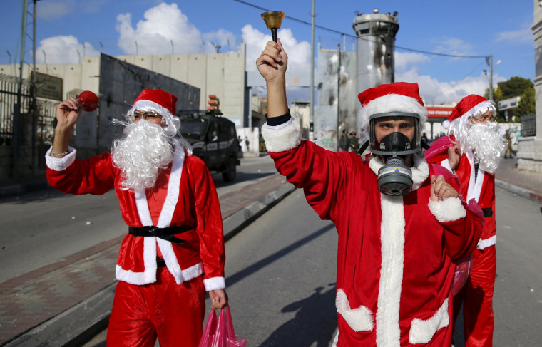 Palestinian Santas Clash With Israeli Soldiers