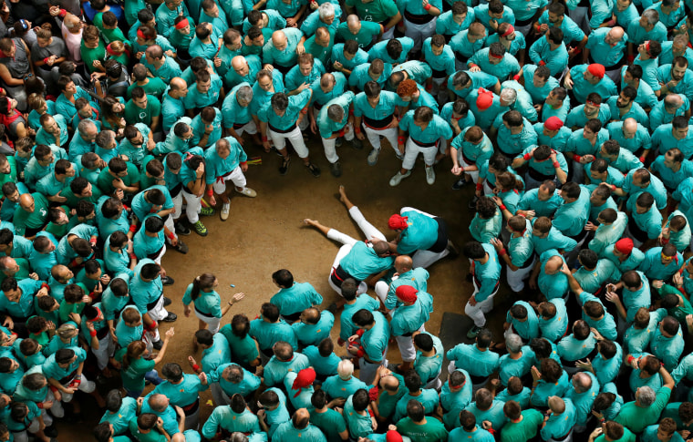 Competitors Attempt to Construct Tallest Human Tower