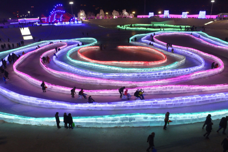 Giant ice sculptures glow in hot neon at winter festival in Harbin, China