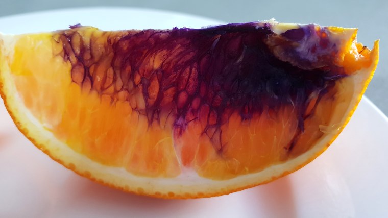 Mystery of purple orange revealed by Australian woman