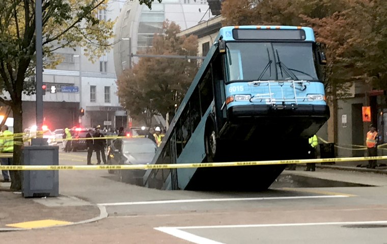 Surreal images show city bus swallowed by sinkhole in downtown Pittsburgh