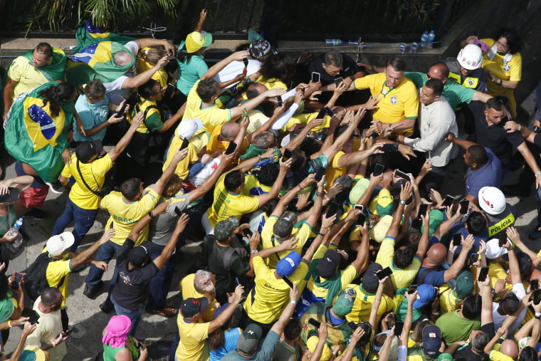 Brazil’s Bolsonaro gathers supporters to show strength amid coup probe