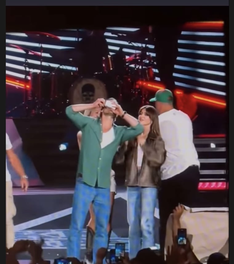 Glen Powell, 'Twisters' Cast Shotgun Beers at Luke Combs' Concert