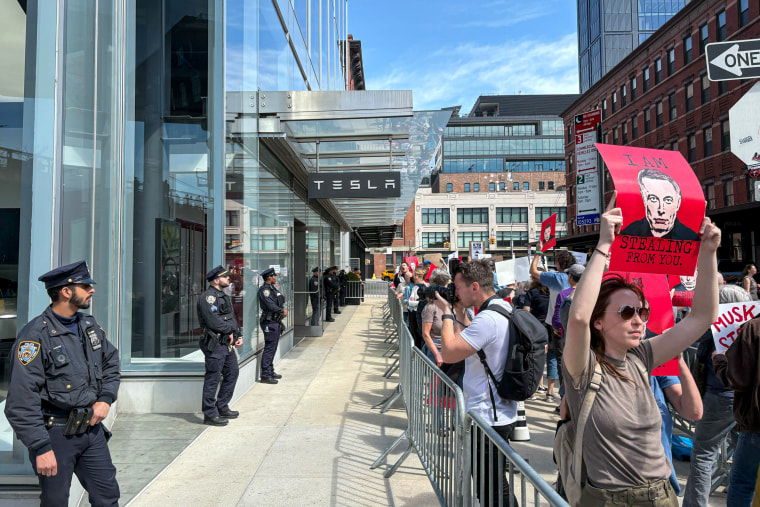 Anti-Elon Musk Protests Held At Tesla Dealerships