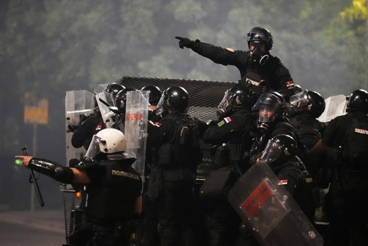 Tensions soar in Serbia as angry protesters clash with police, set fire ...