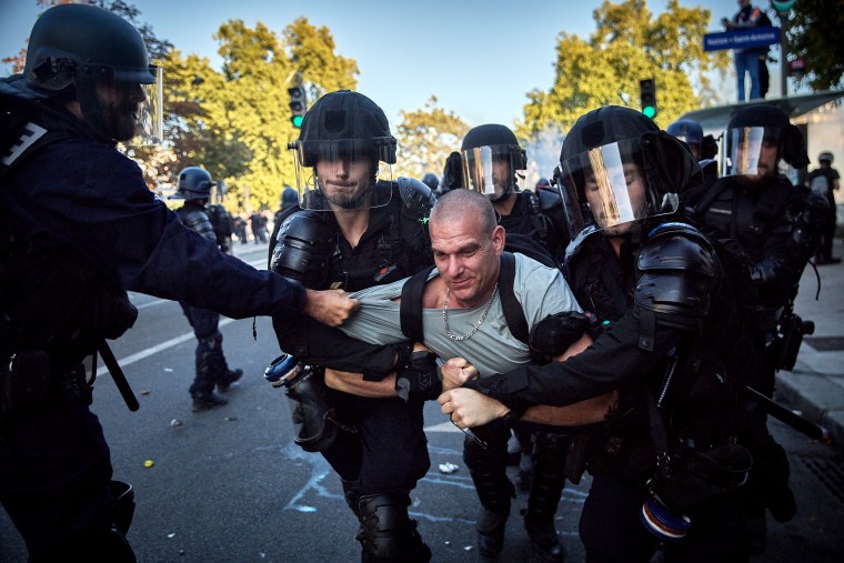 Strikes and protests roil France, pitting the streets against Macron ...