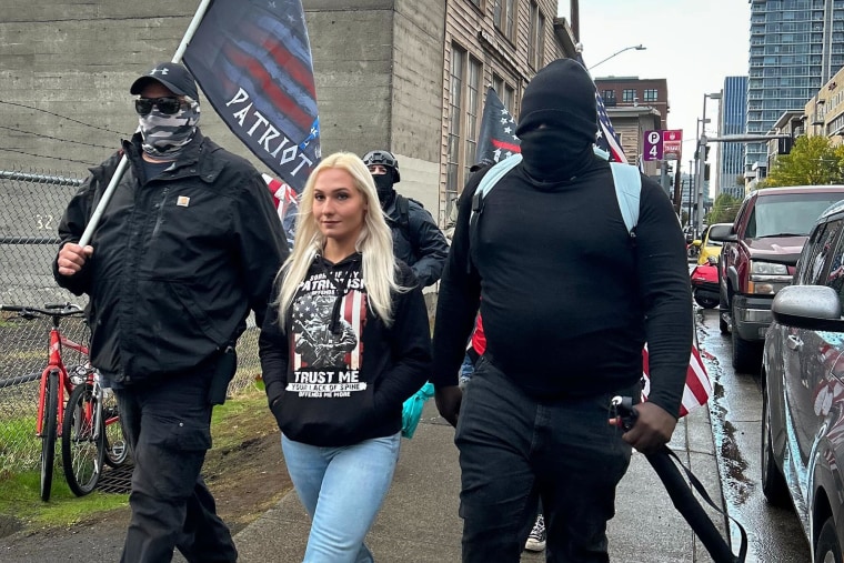In Portland, nude cyclists join anti-ICE protests in rain-soaked ride