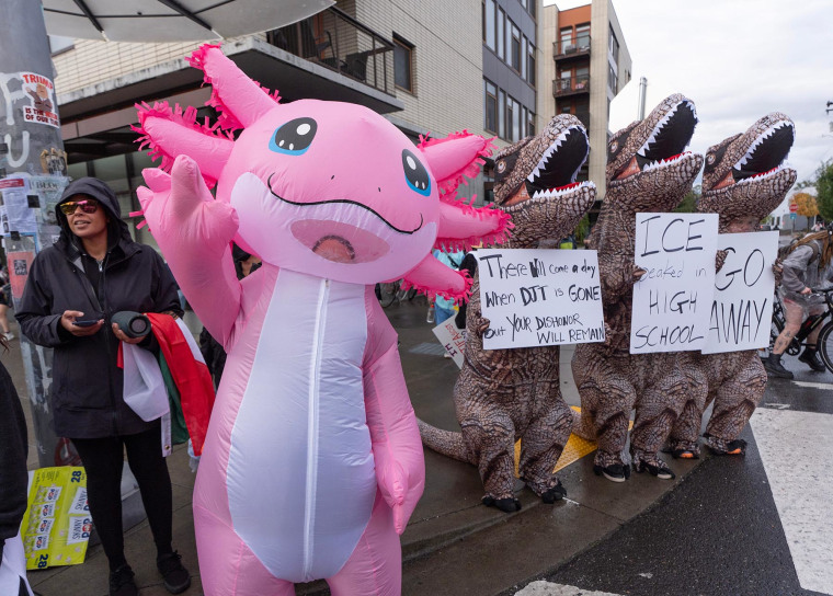 In Portland, nude cyclists join anti-ICE protests in rain-soaked ride